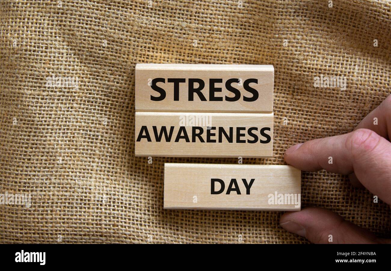 Stress awareness day symbol. Wooden blocks with words 'Stress awareness ...