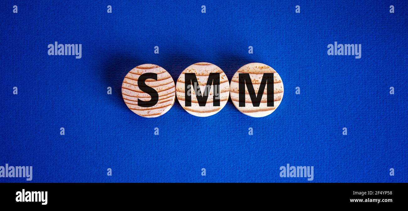 SMM, social media marketing symbol. Wooden circles with word 'SMM ...
