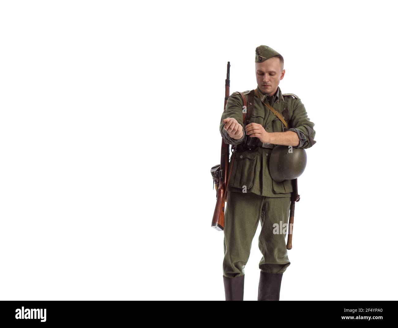 Man actor in the movie role of an military man with a machine gun ...