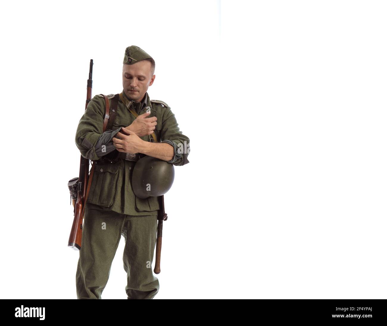 Man actor in the movie role of an military man with a machine gun ...