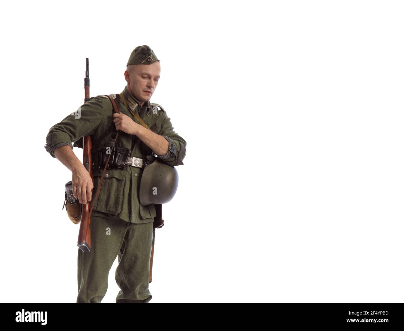 Man actor in the movie role of an military man with a machine gun ...