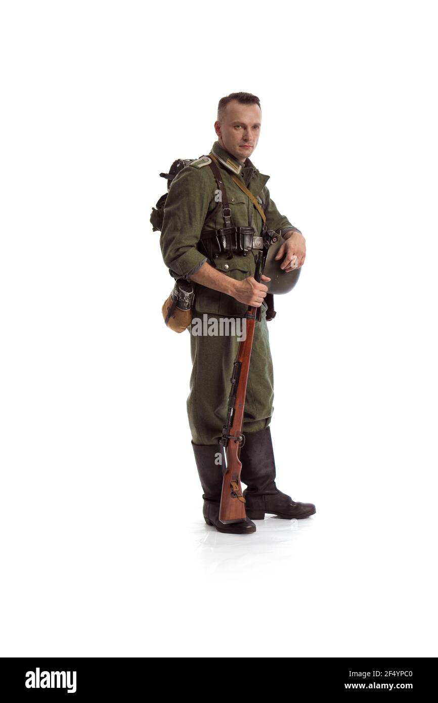 Man actor in the movie role of an military man with a machine gun ...