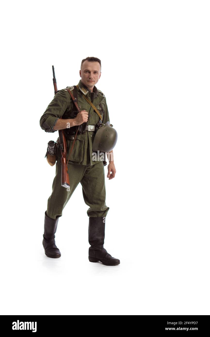 Man actor in the movie role of an military man with a machine gun ...