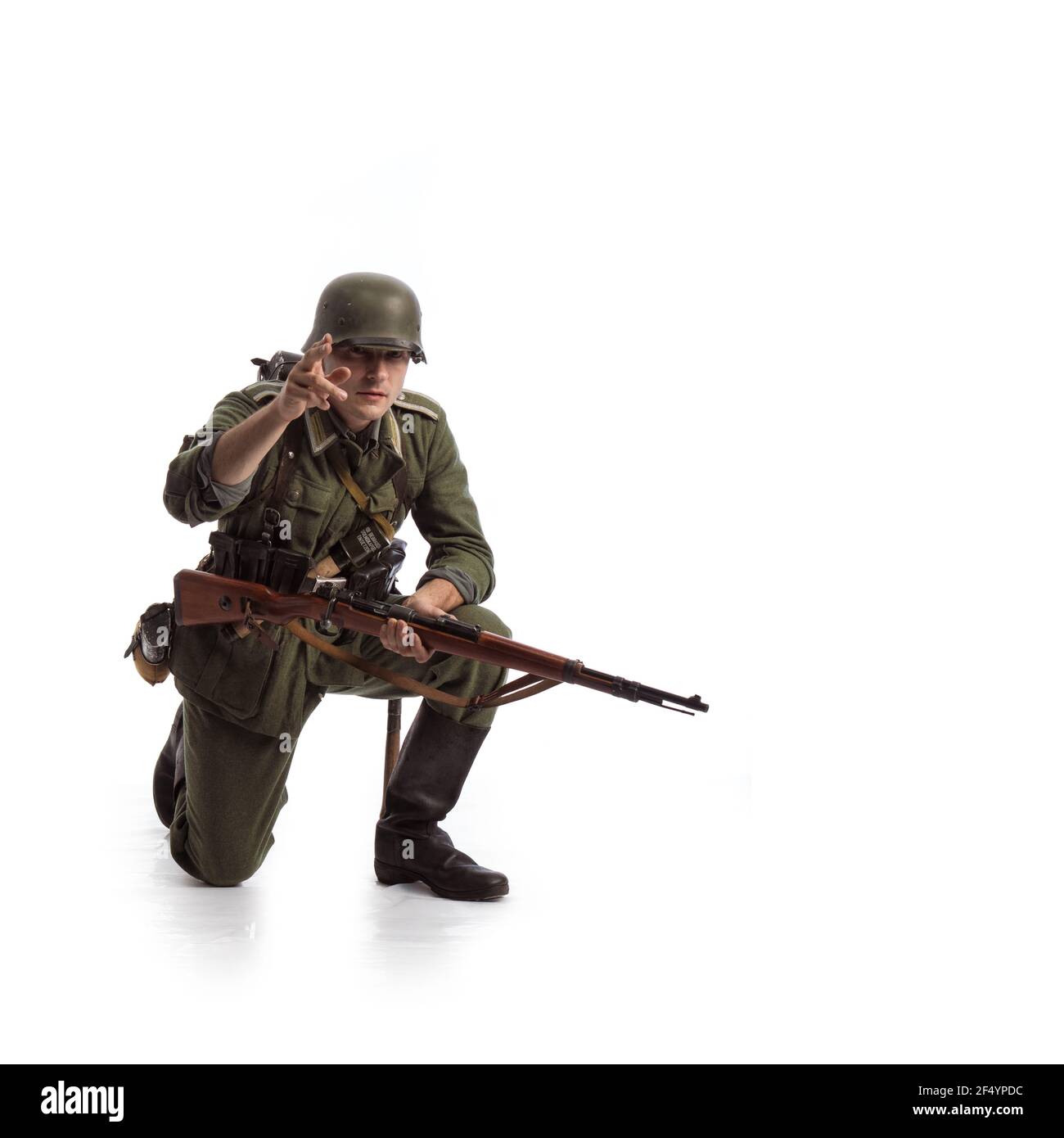 Man actor in the movie role of an military man with a machine gun ...