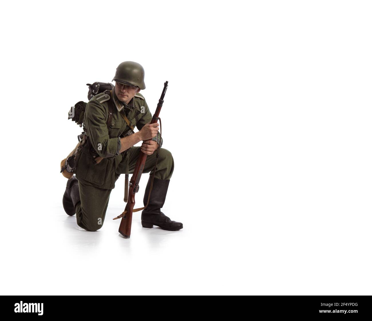 Man actor in the movie role of an military man with a machine gun ...