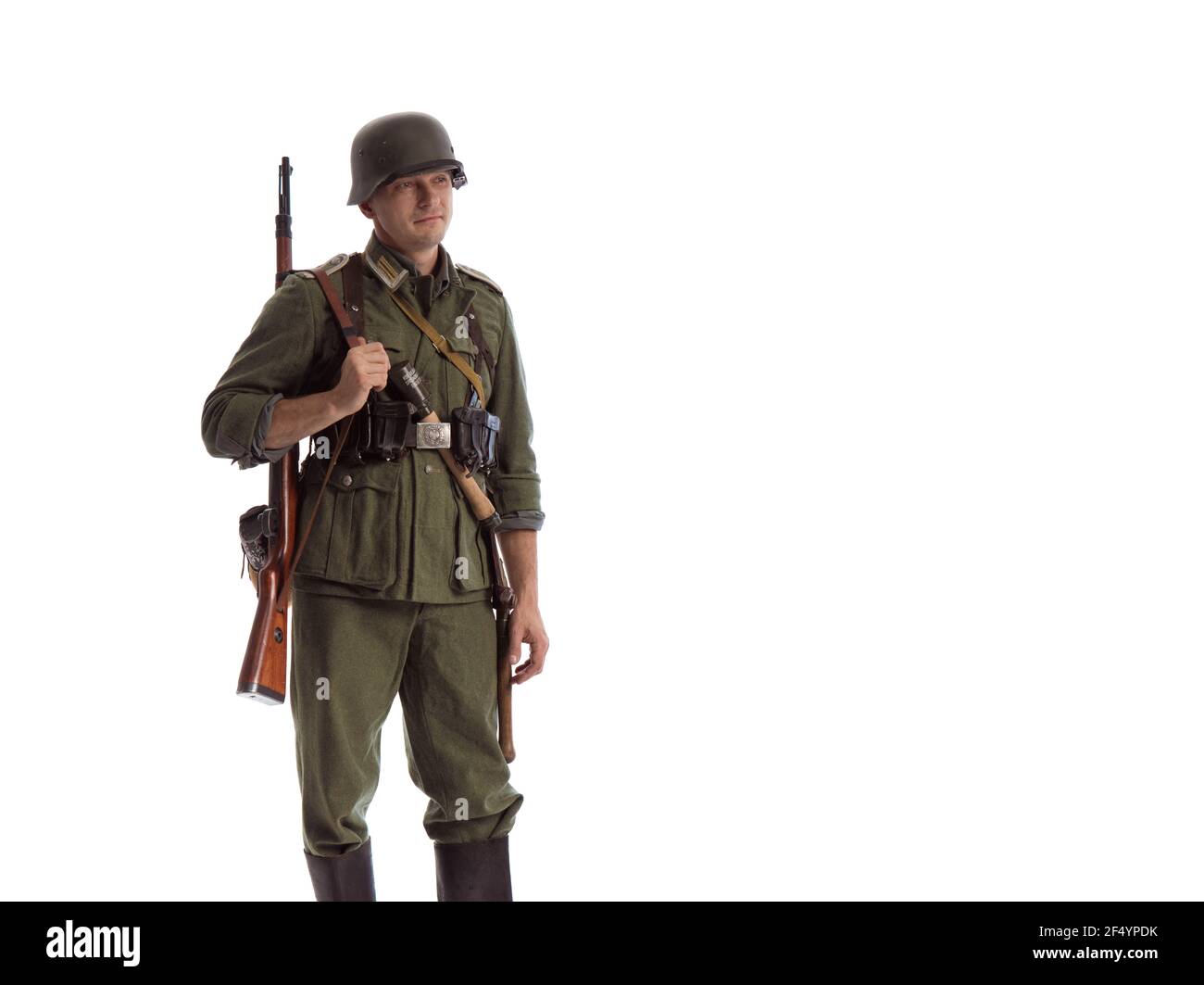 Man actor in the movie role of an military man with a machine gun ...