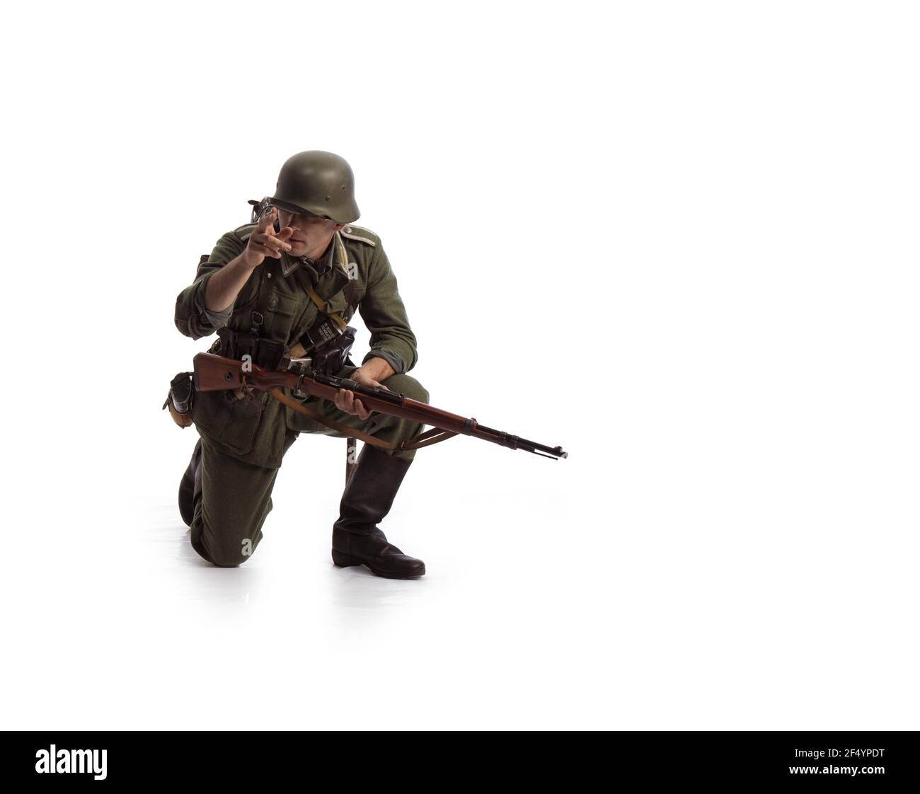 Man actor in the movie role of an military man with a machine gun ...