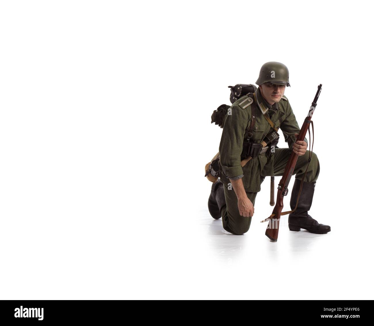 Man actor in the movie role of an military man with a machine gun ...