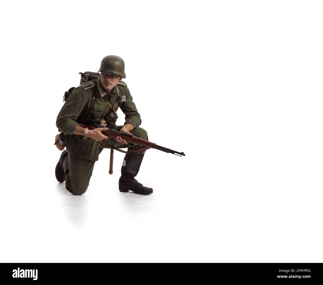 Man actor in the movie role of an military man with a machine gun ...