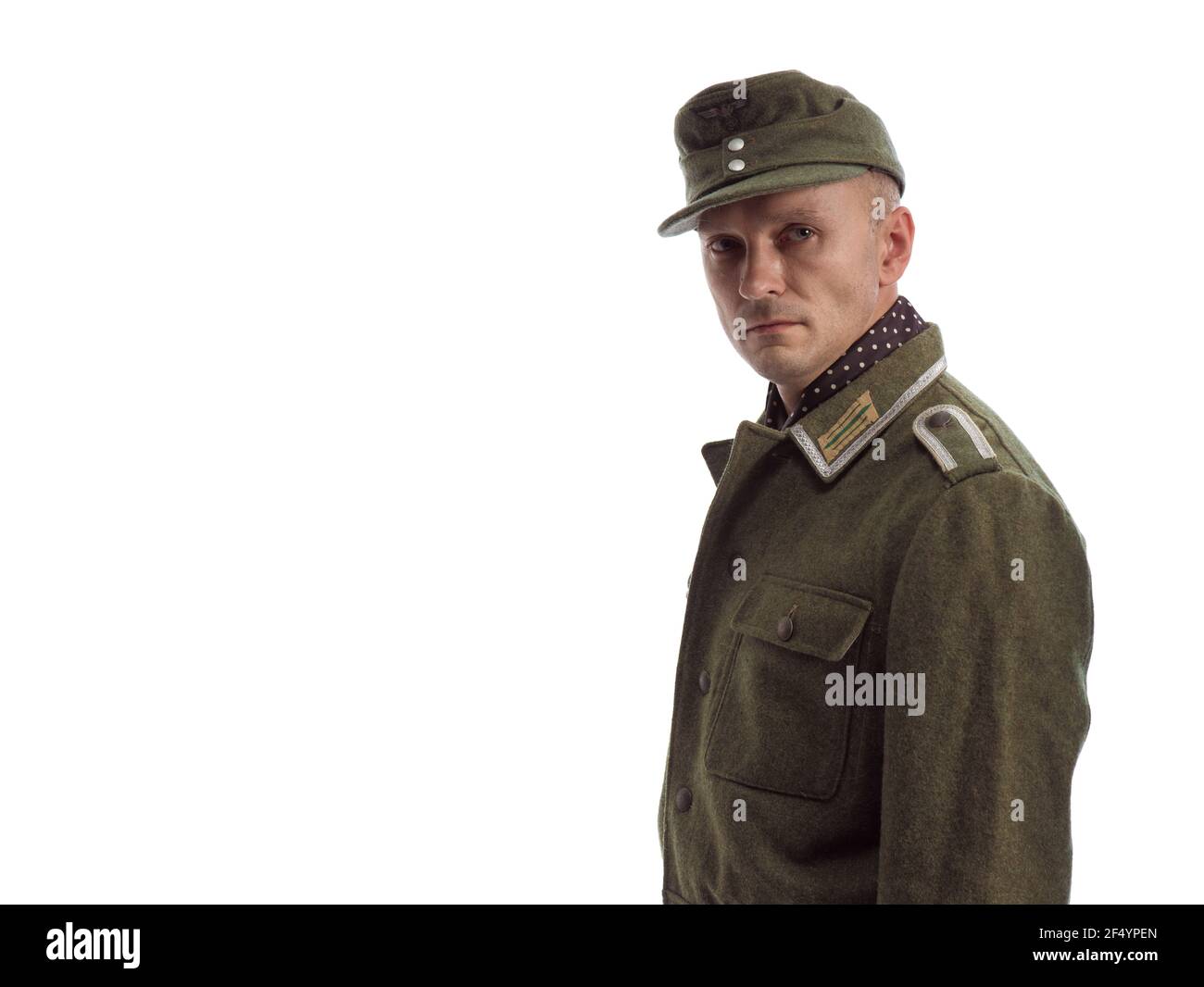 Man actor in the movie role of an military man with a machine gun ...