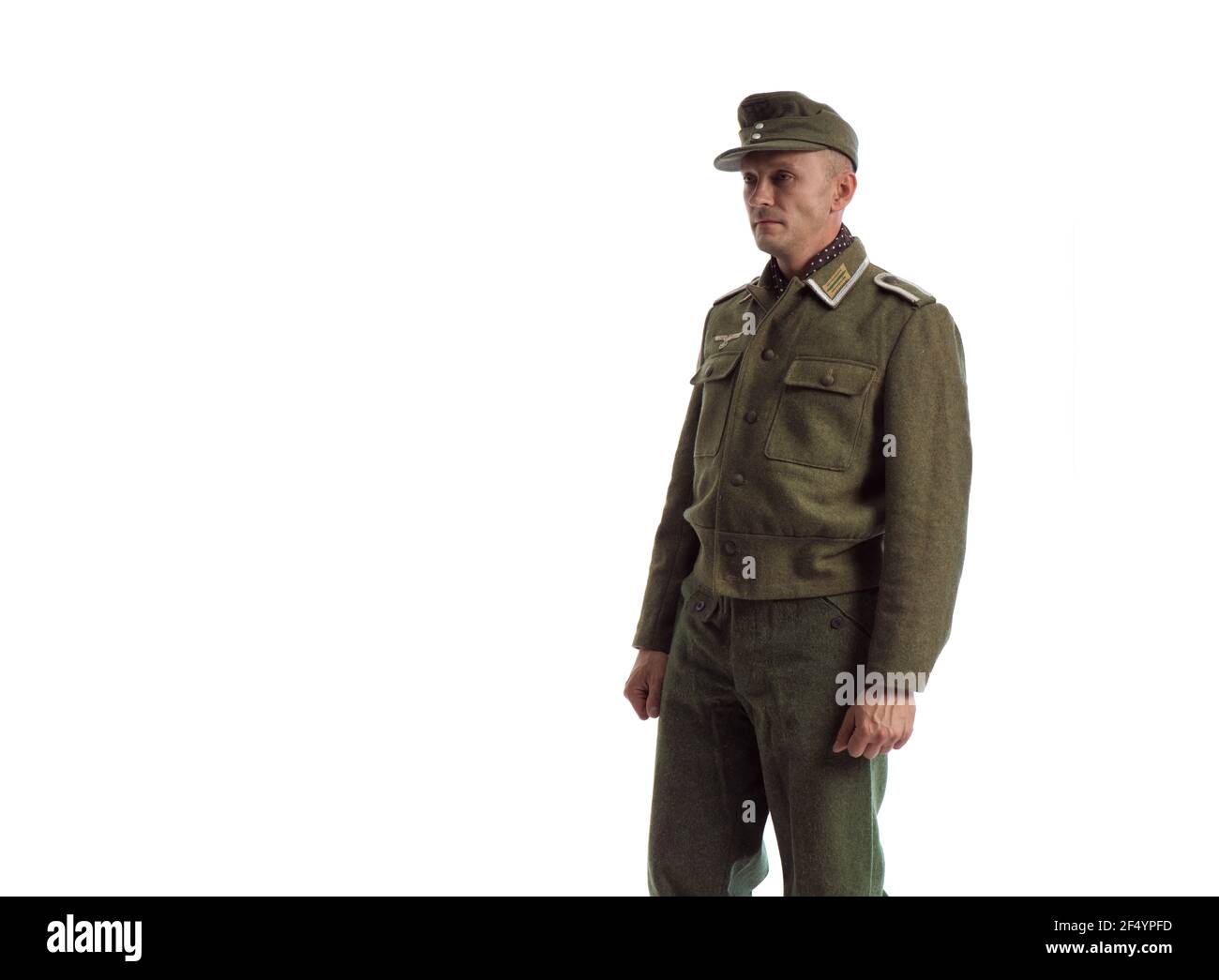 Man actor in the movie role of an military man with a machine gun ...