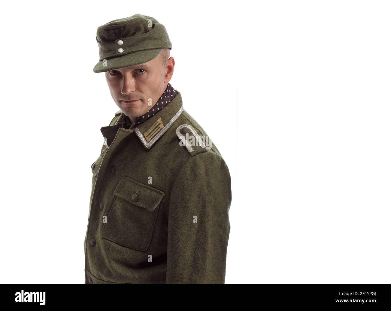 Man actor in the movie role of an military man with a machine gun ...