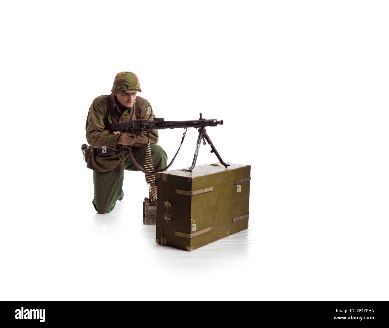 Man actor in the movie role of an military man with a machine gun ...