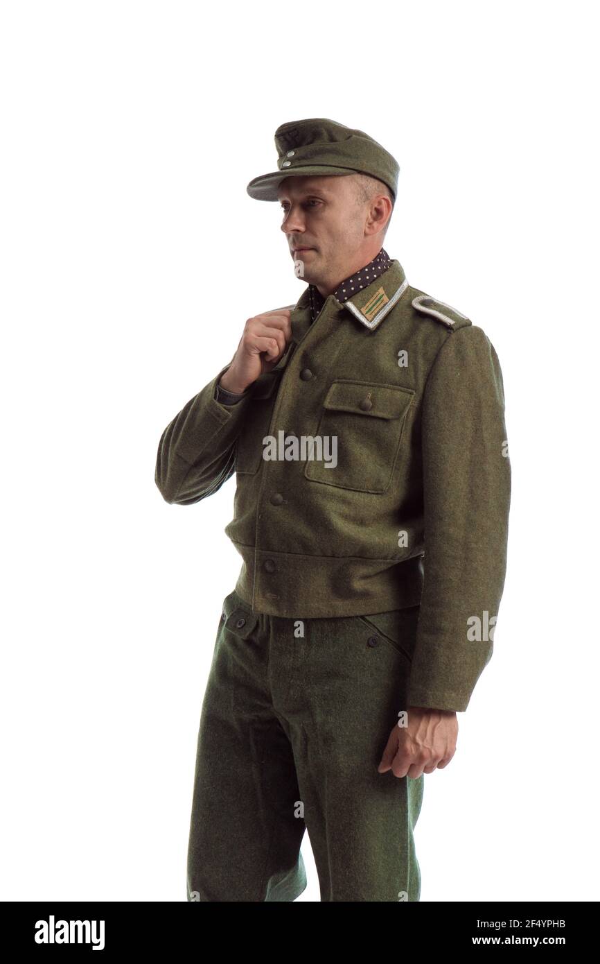 Man actor in the movie role of an military man with a machine gun ...