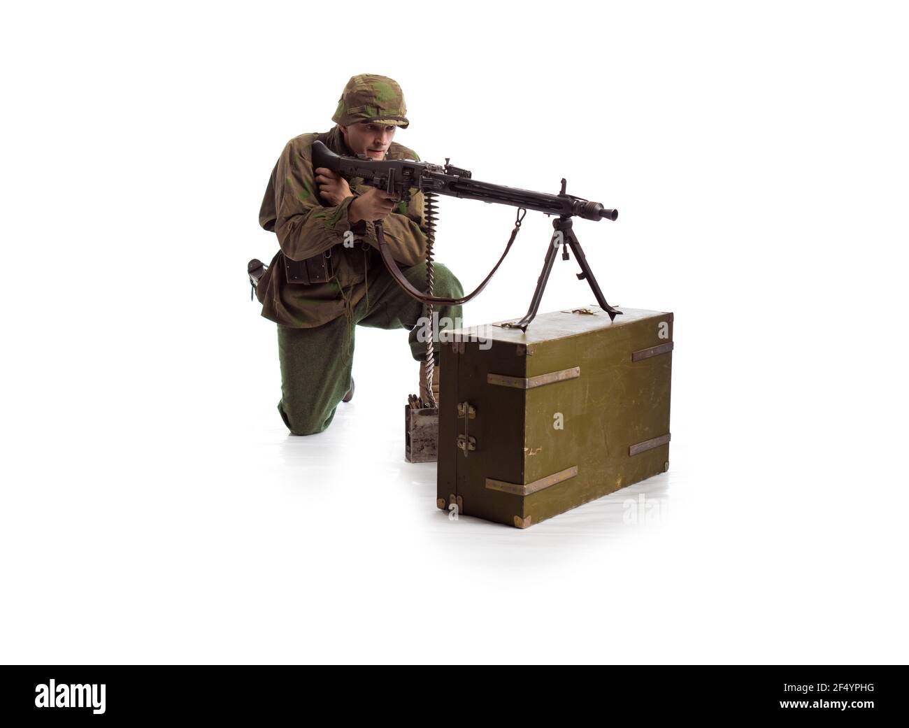 Man actor in the movie role of an military man with a machine gun ...