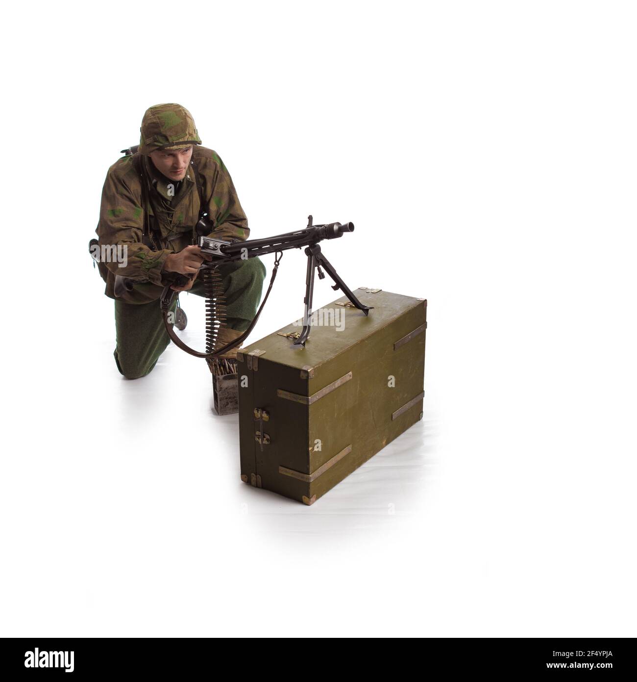 Man actor in the movie role of an military man with a machine gun ...