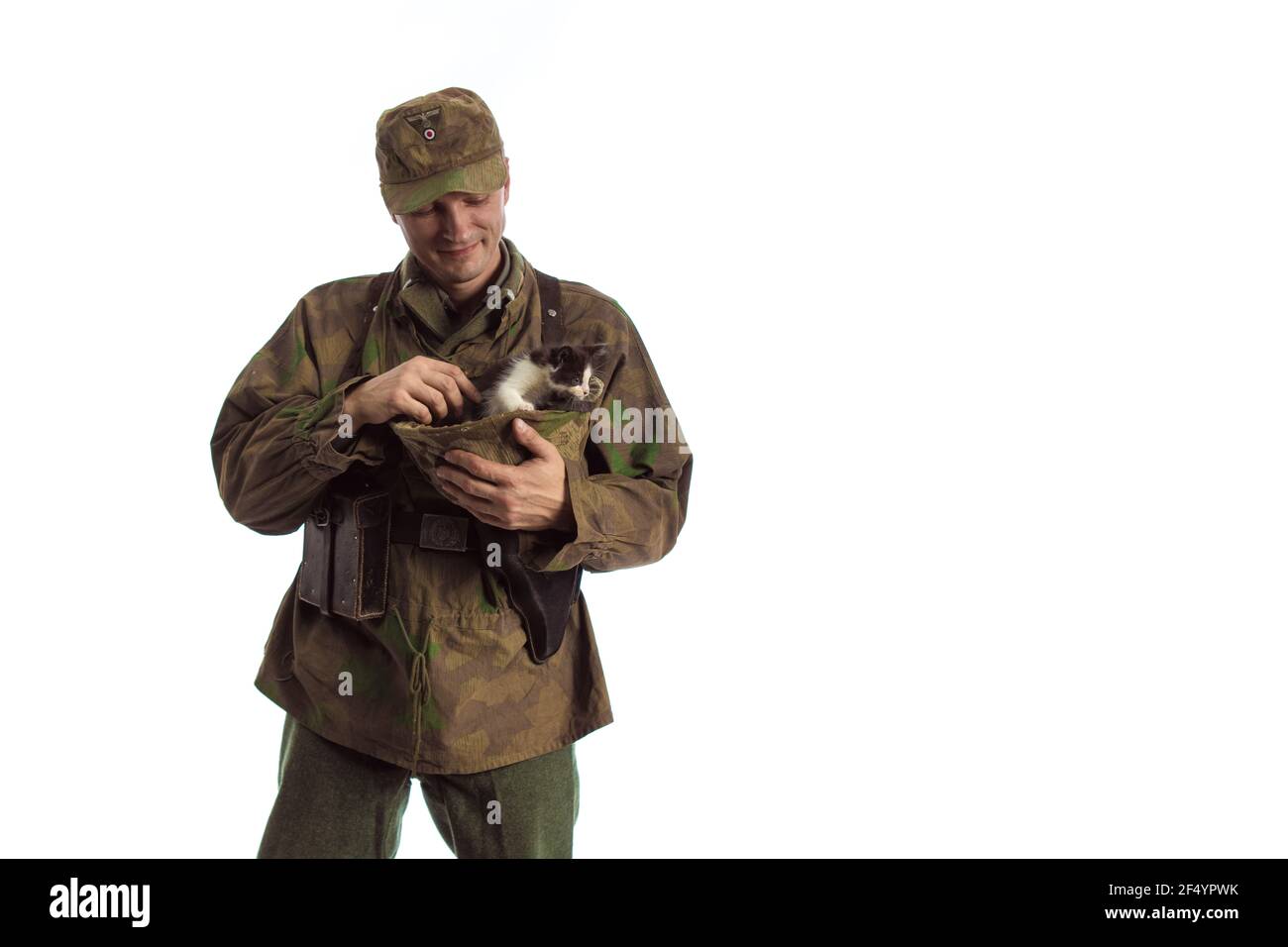 Man actor in the movie role of an military man with a machine gun ...