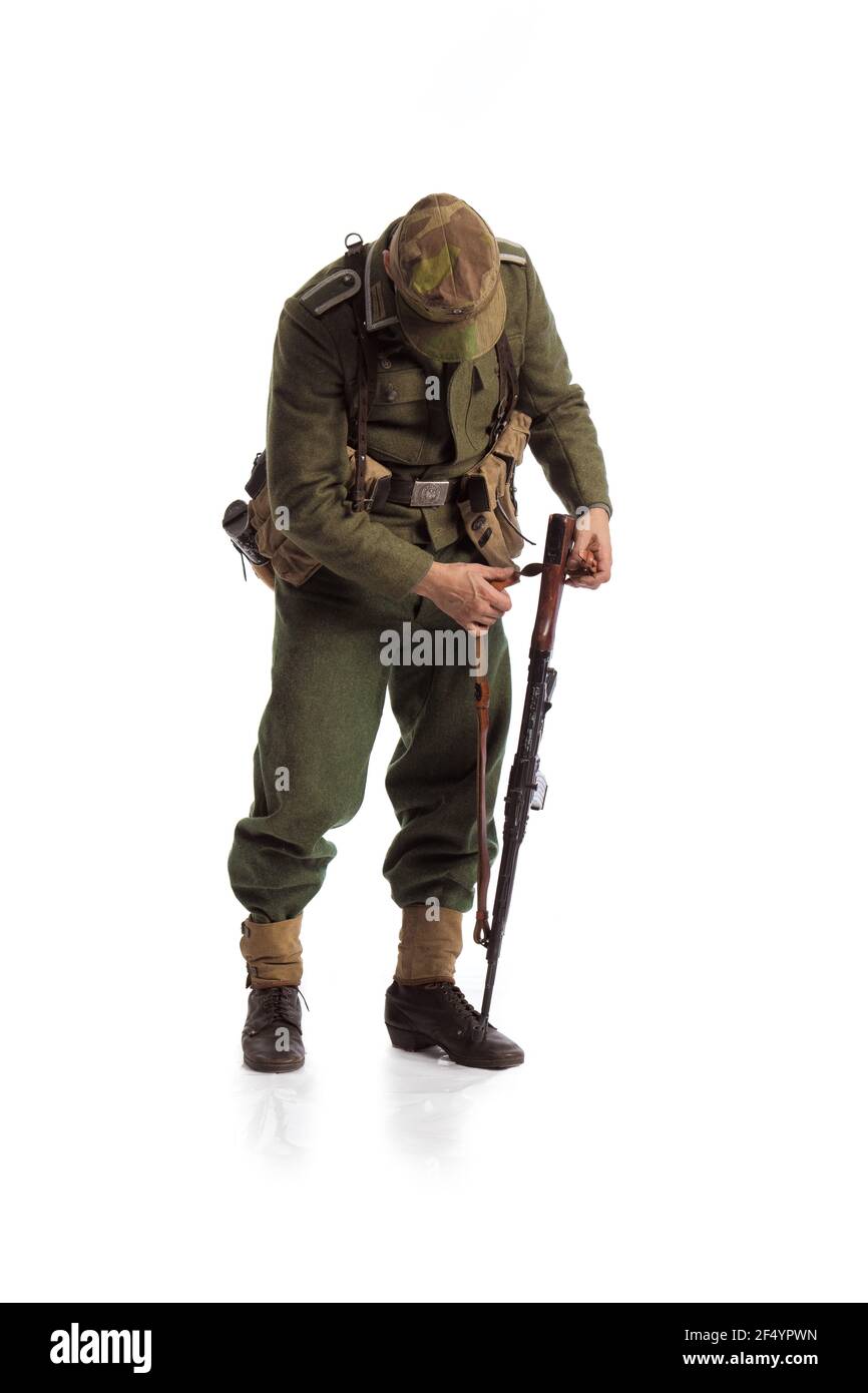 Man actor in the movie role of an military man with a machine gun ...