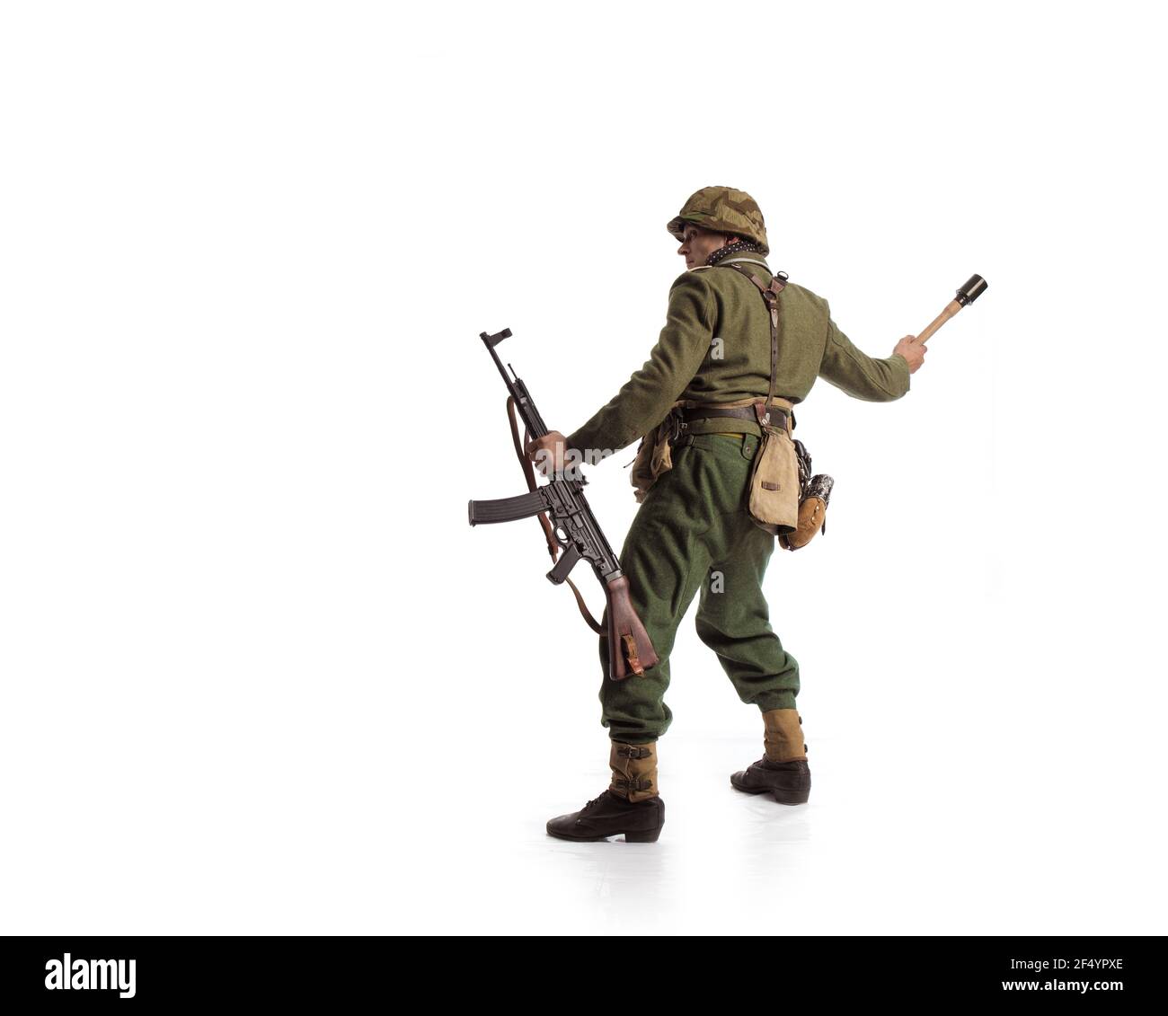 Man actor in the movie role of an military man with a machine gun ...