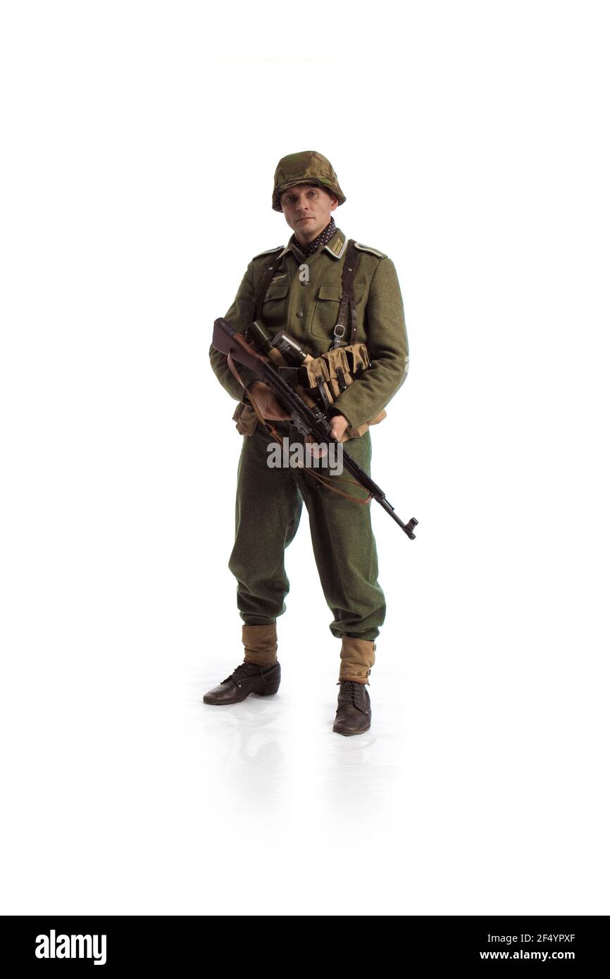 Man actor in the movie role of an military man with a machine gun ...