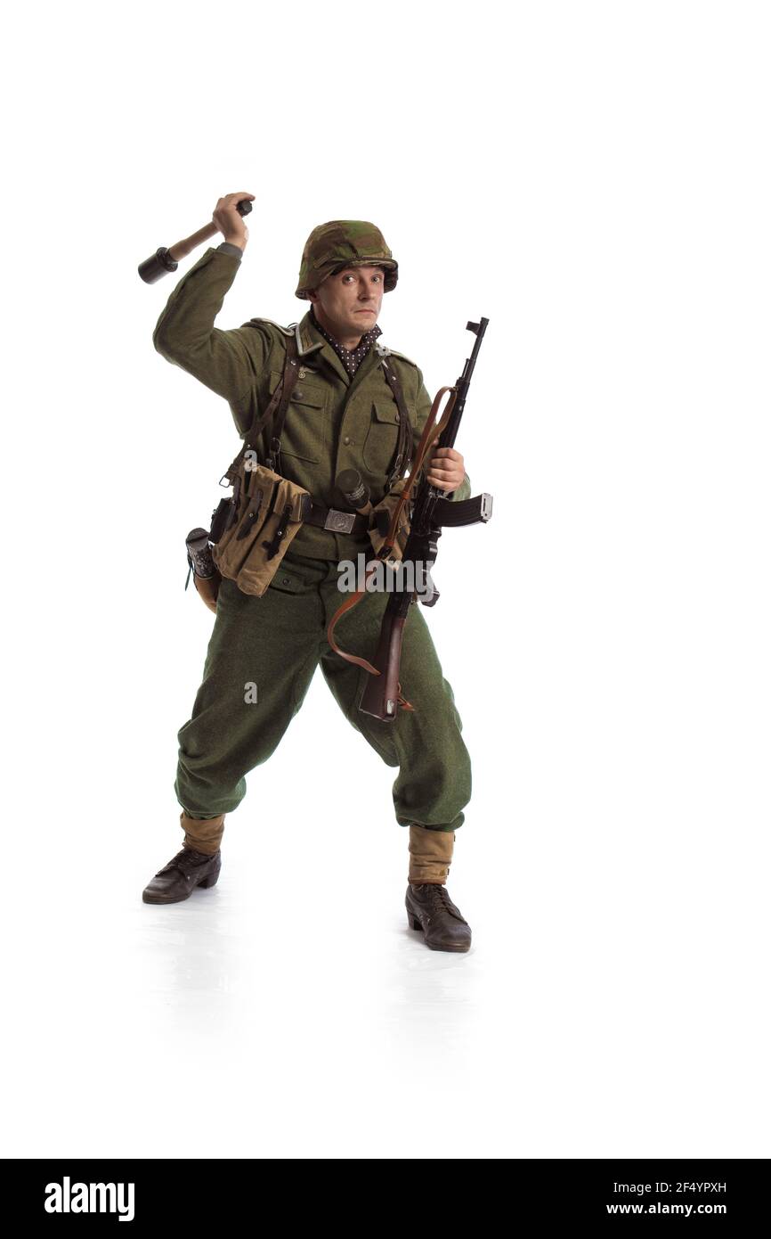 Man actor in the movie role of an military man with a machine gun ...