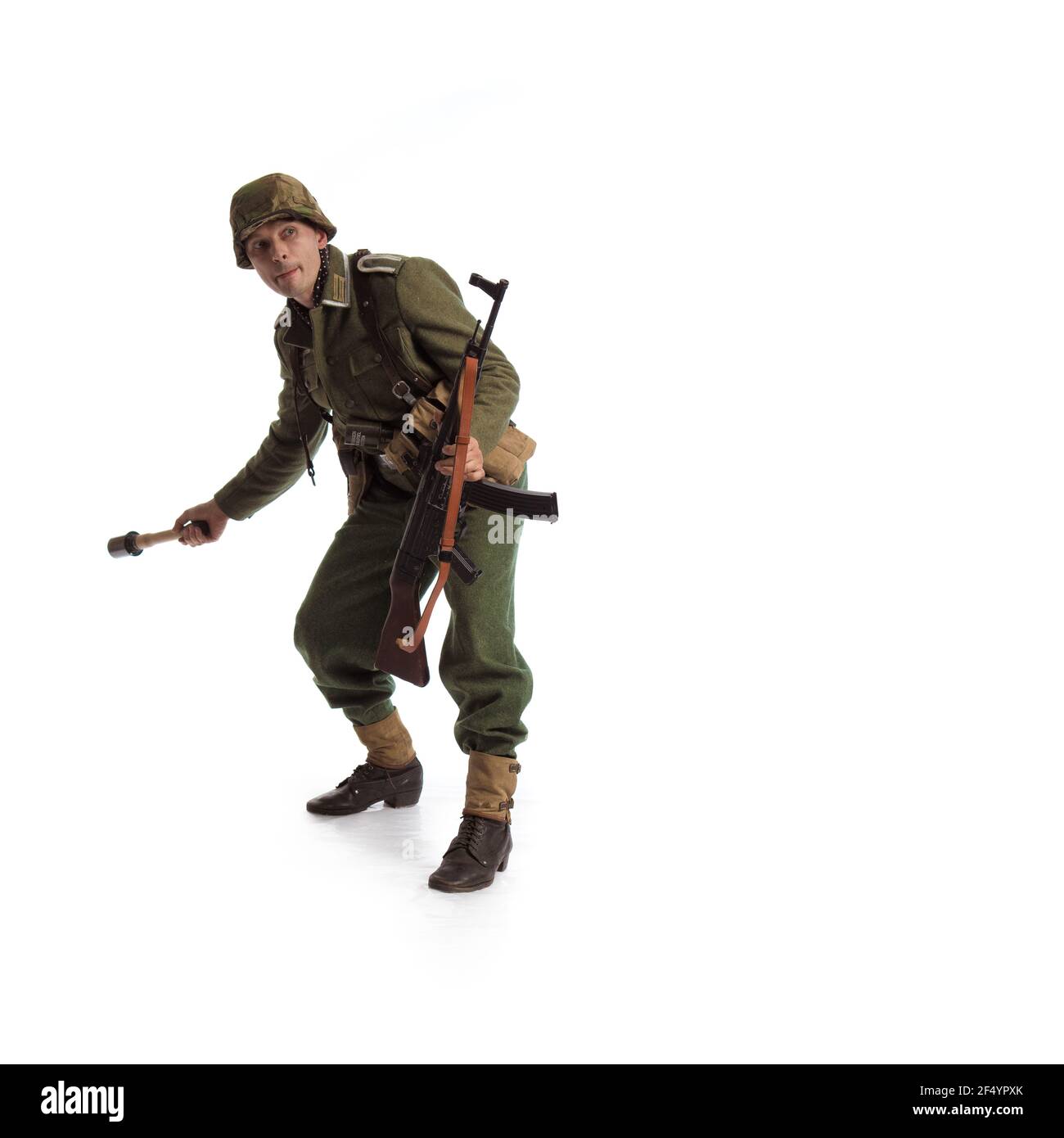 Man actor in the movie role of an military man with a machine gun ...