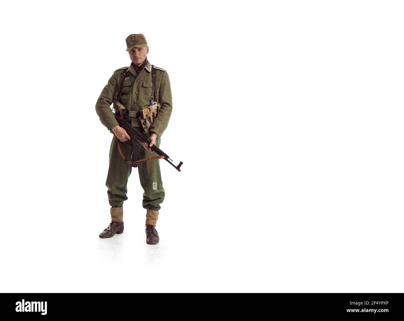 Man actor in the movie role of an military man with a machine gun ...