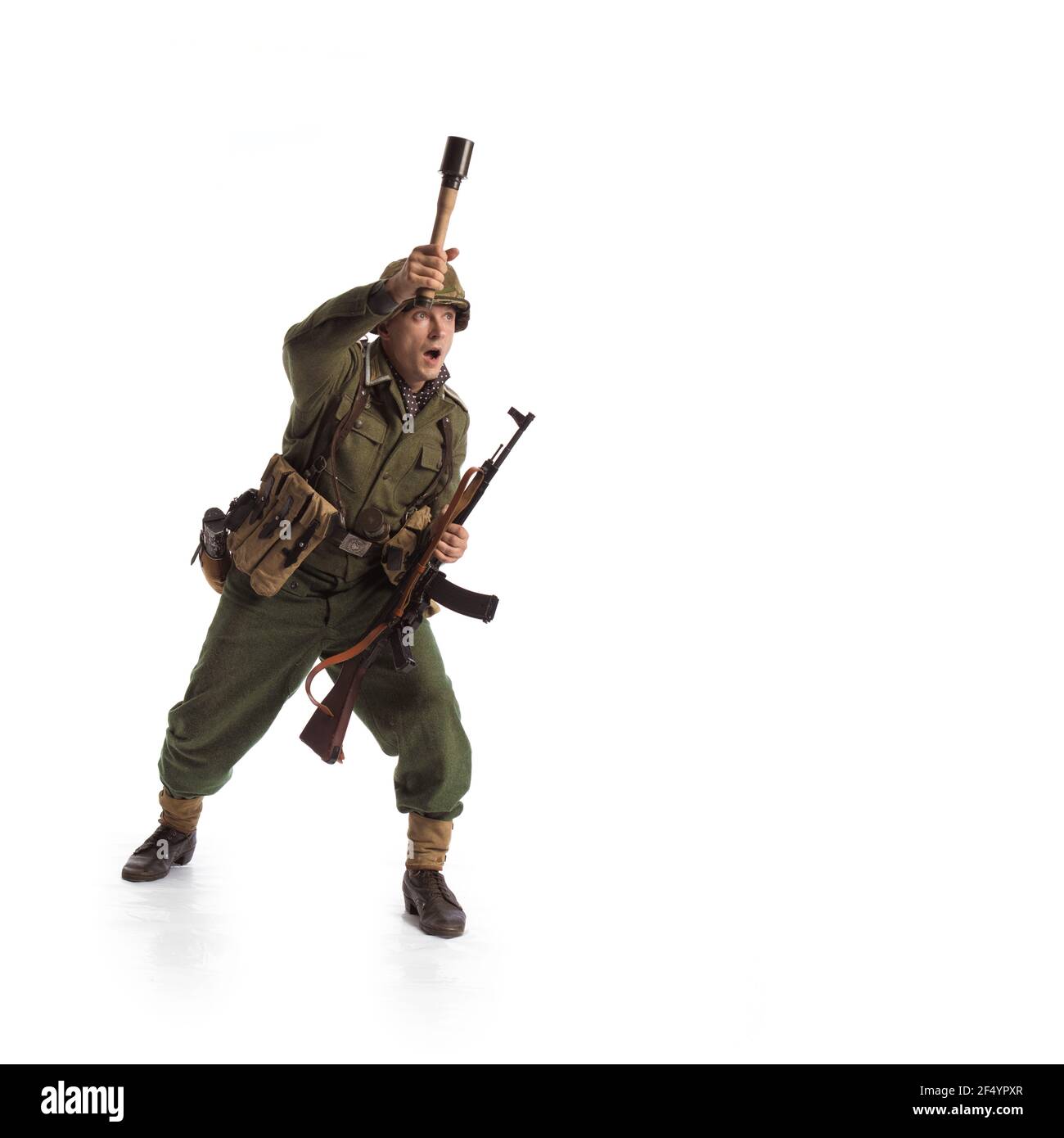 Man actor in the movie role of an military man with a machine gun ...