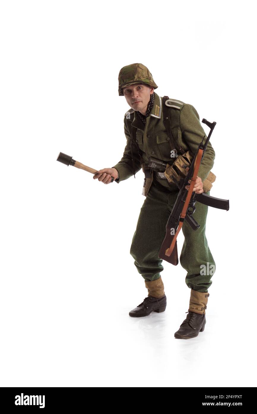 Man actor in the movie role of an military man with a machine gun ...