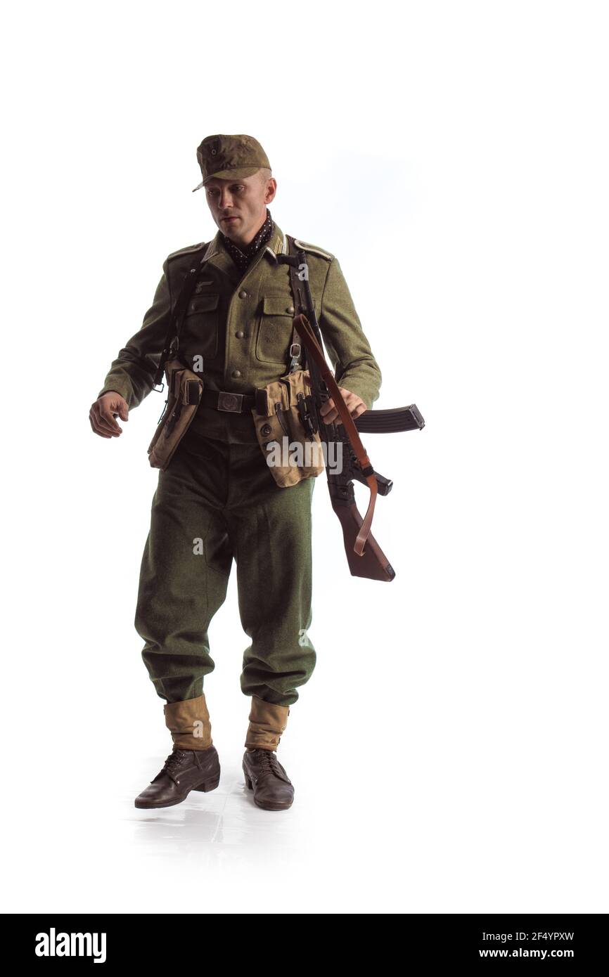 Man actor in the movie role of an military man with a machine gun ...