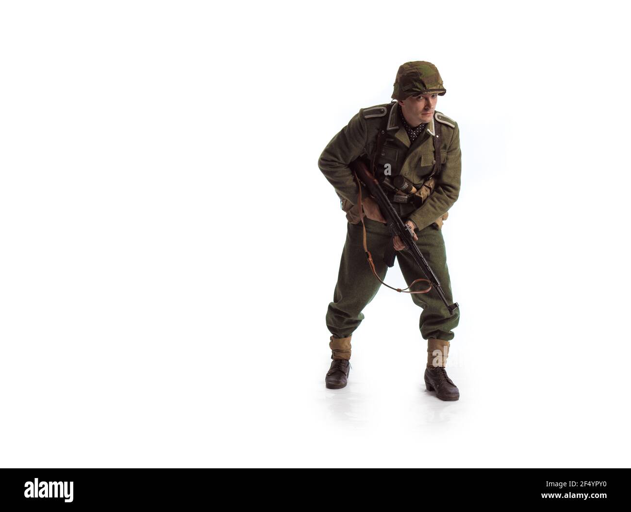 Man actor in the movie role of an military man with a machine gun ...