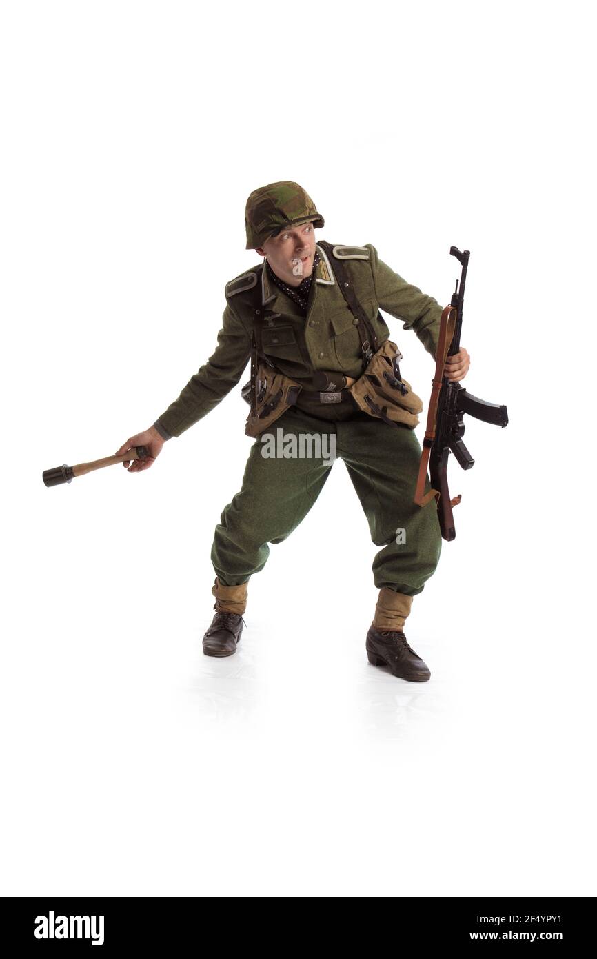 Man actor in the movie role of an military man with a machine gun ...