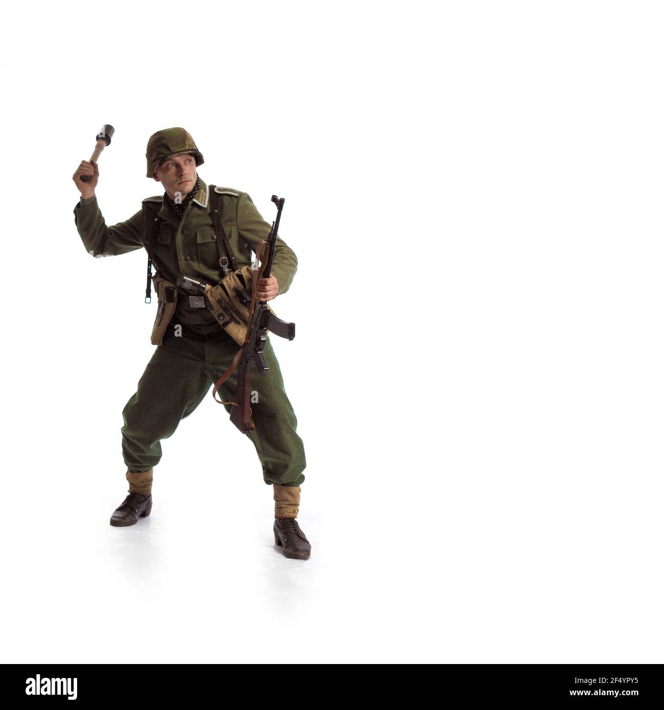 Man actor in the movie role of an military man with a machine gun ...