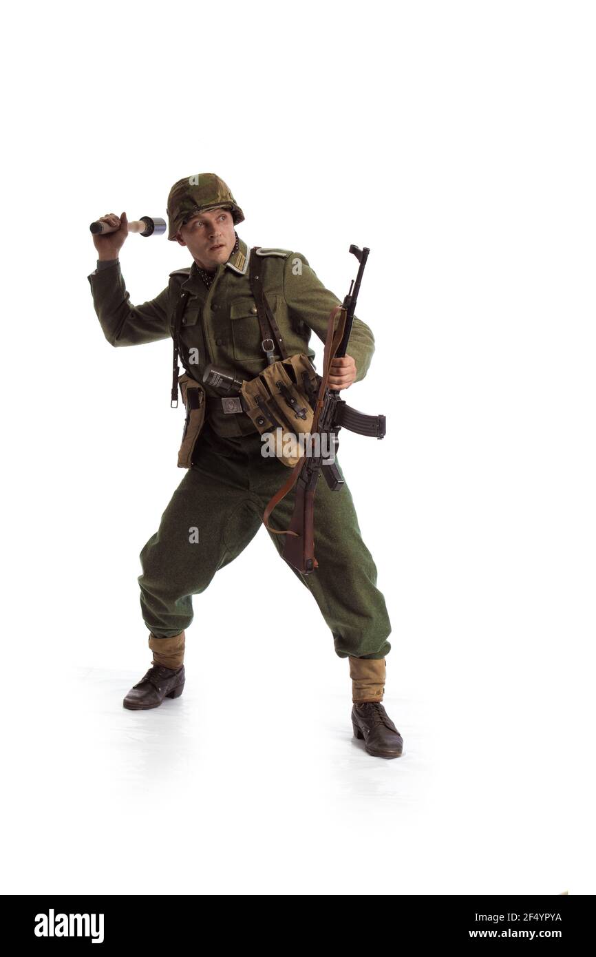 Man actor in the movie role of an military man with a machine gun ...