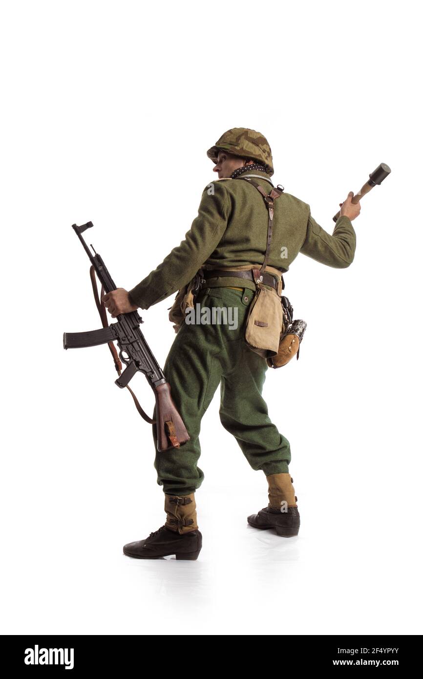 Man actor in the movie role of an military man with a machine gun ...