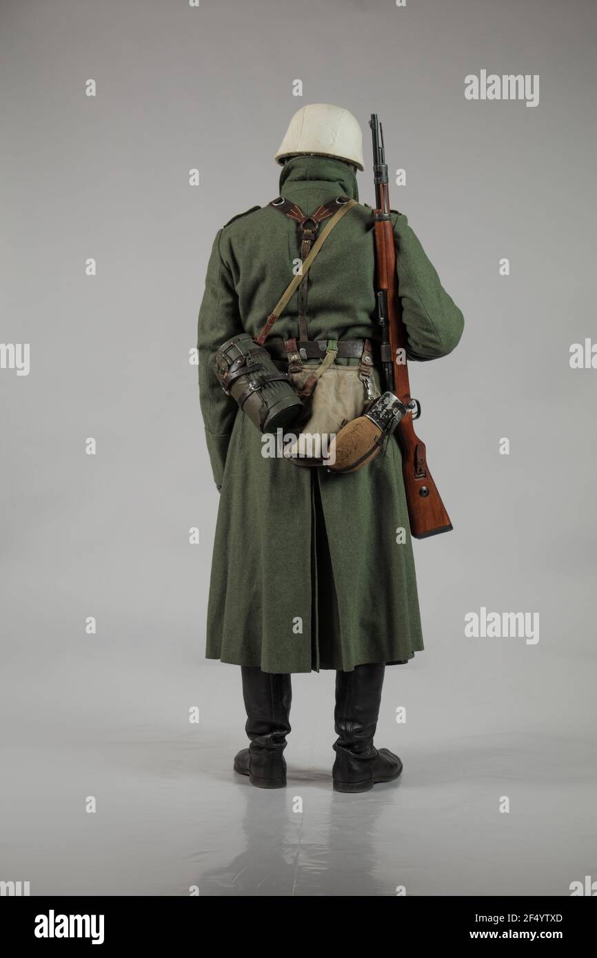 male actor in the winter military uniform of an German soldier, the ...