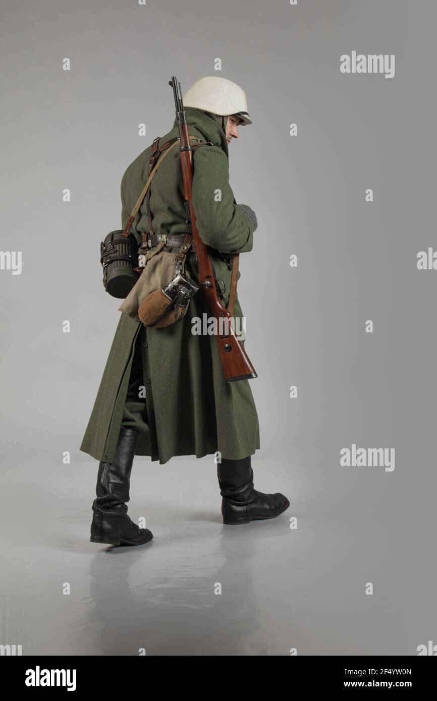 male actor in the winter military uniform of an German soldier, the ...