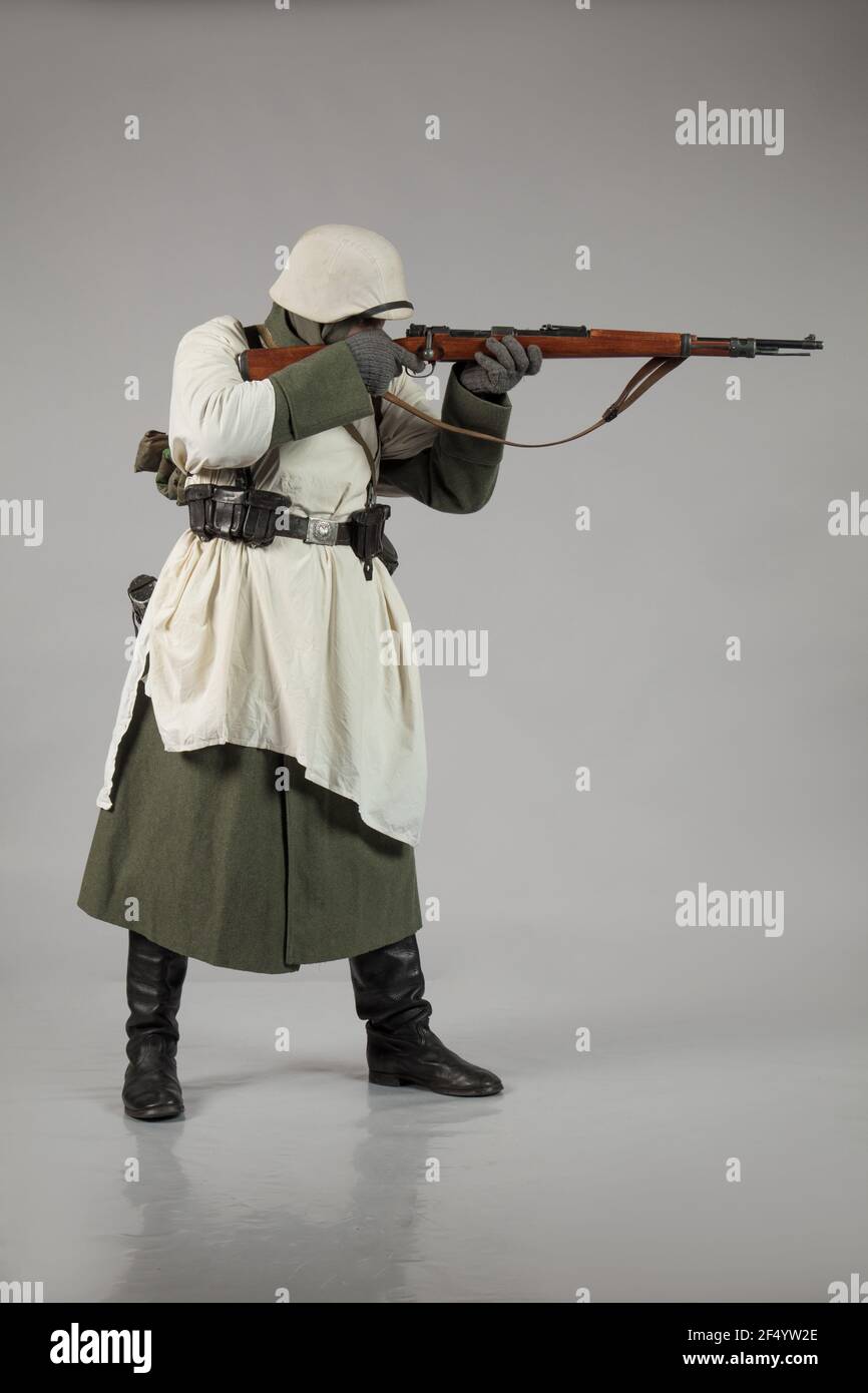 male actor in the winter military uniform of an German soldier, the ...