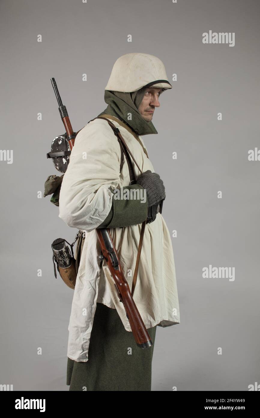 male actor in the winter military uniform of an German soldier, the ...
