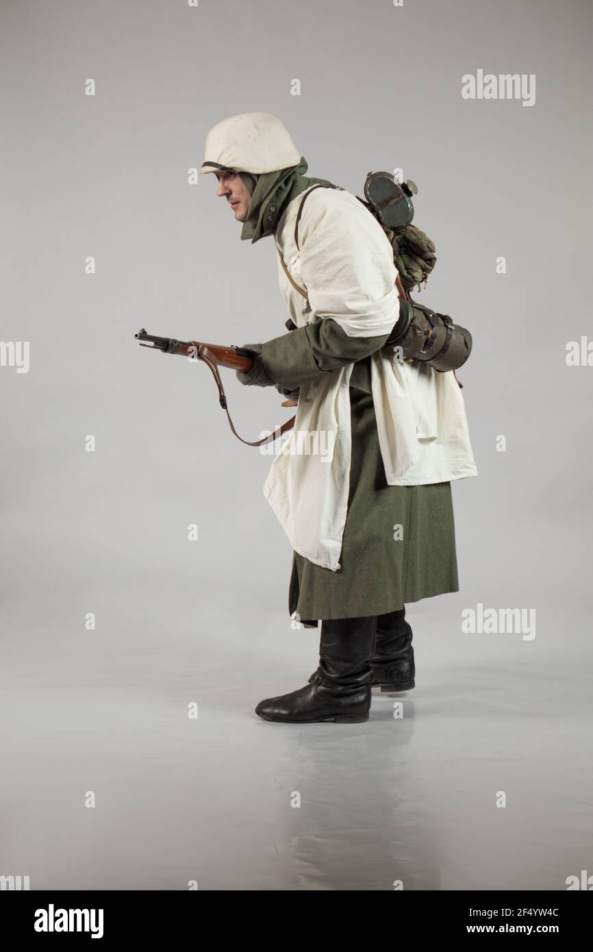 male actor in the winter military uniform of an German soldier, the ...