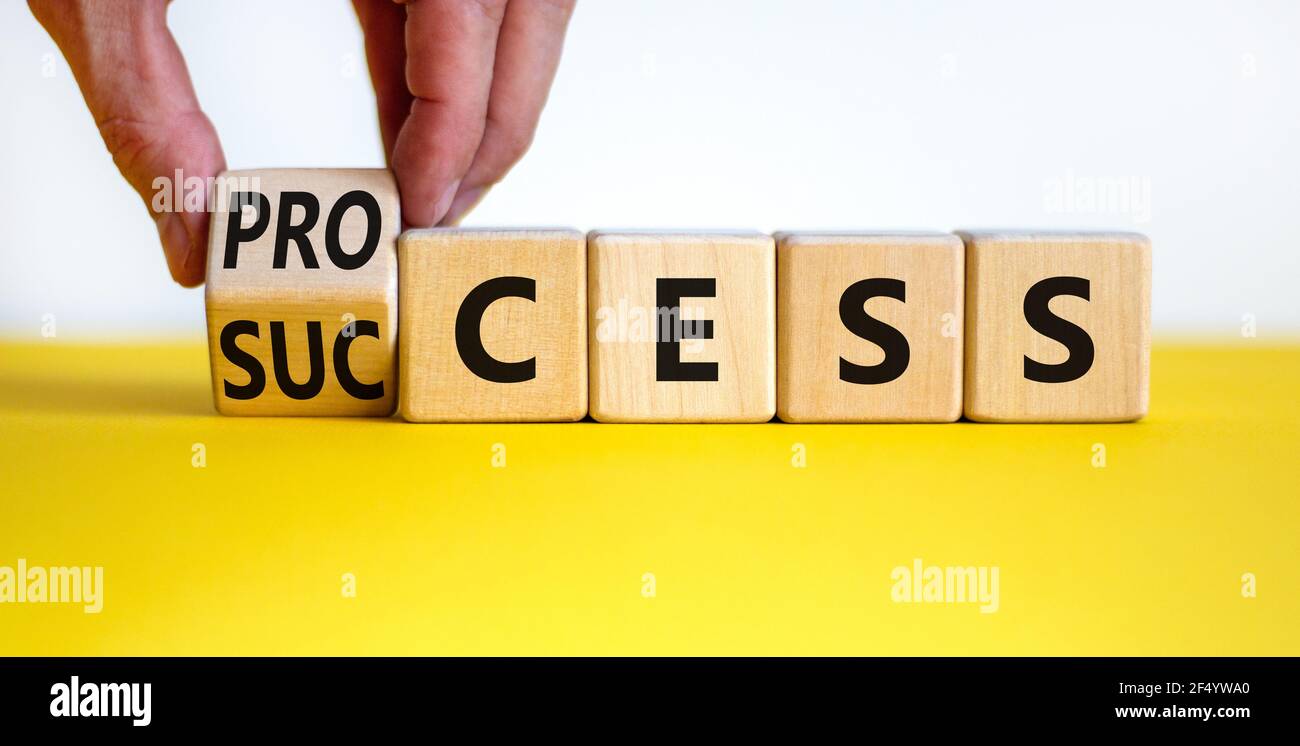 Success process symbol. Businessman turns wooden cubes and changes the ...