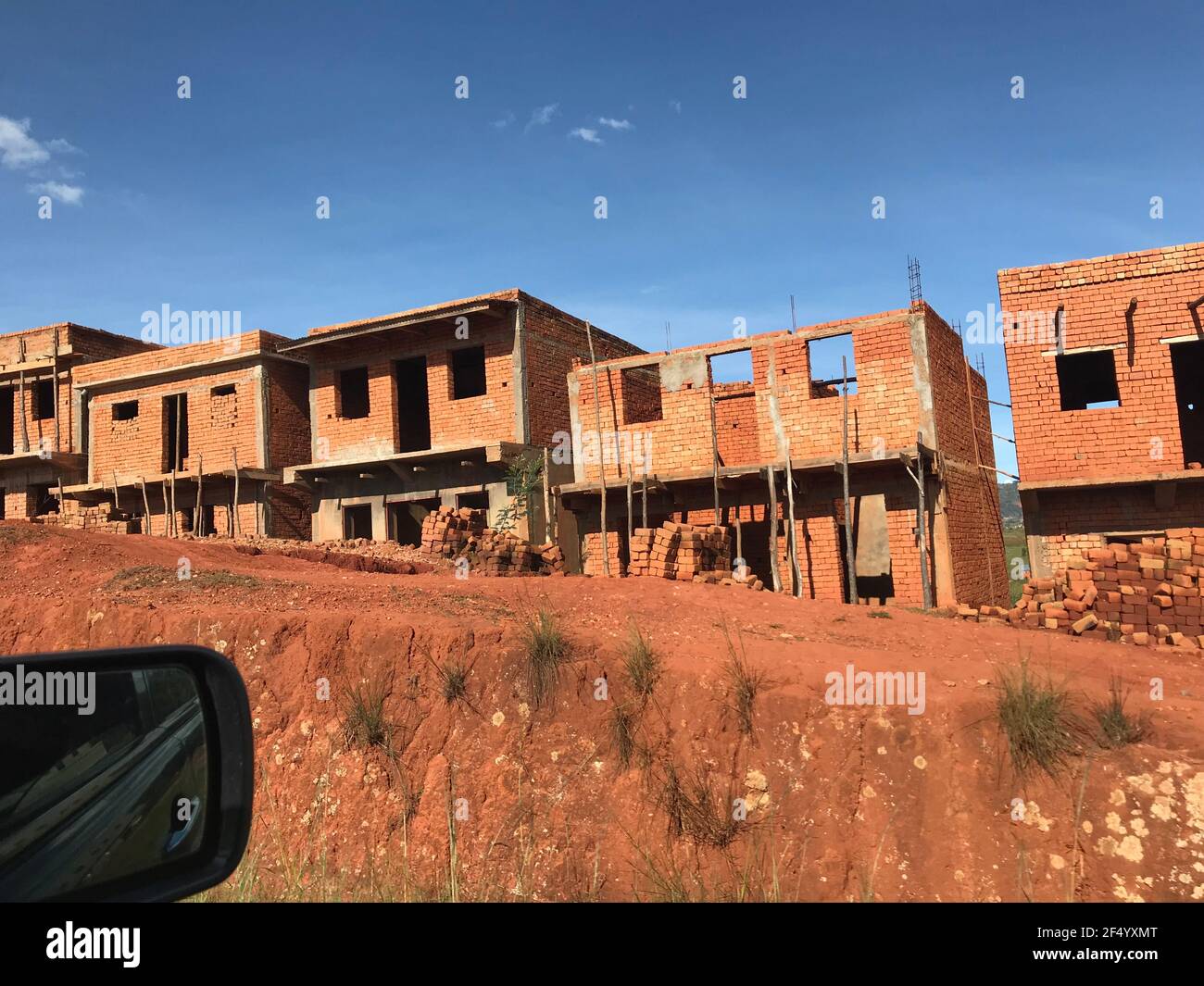 Traditional Malagasy red clay village houses Stock Photo - Alamy