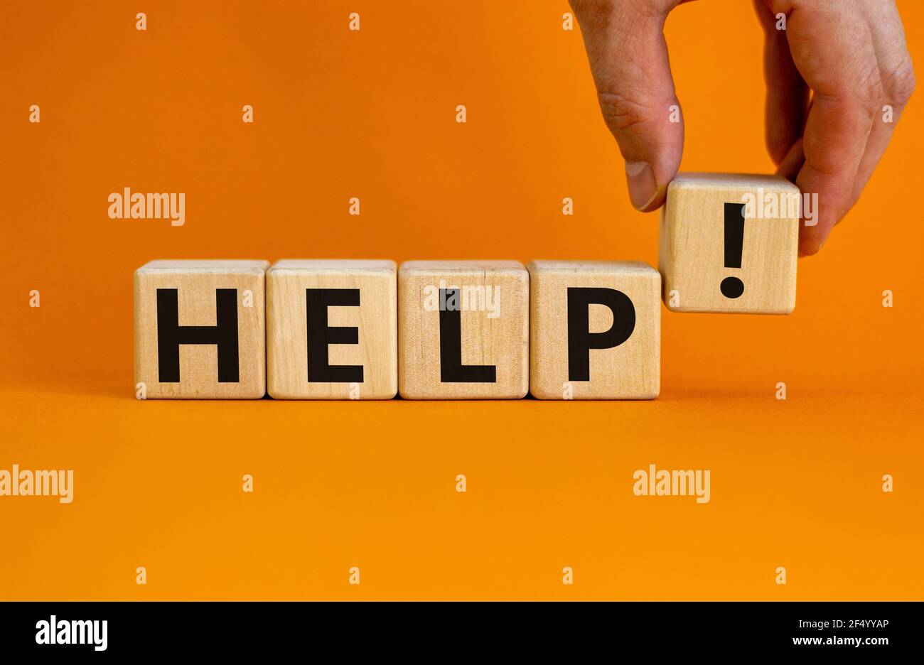 Support and help symbol. Wooden cubes with the word 'help'. Businessman ...
