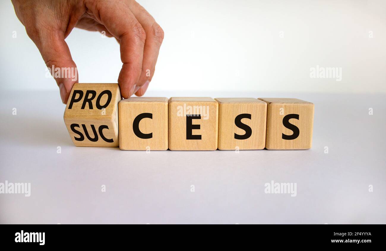 Success process symbol. Businessman turns wooden cubes and changes the ...