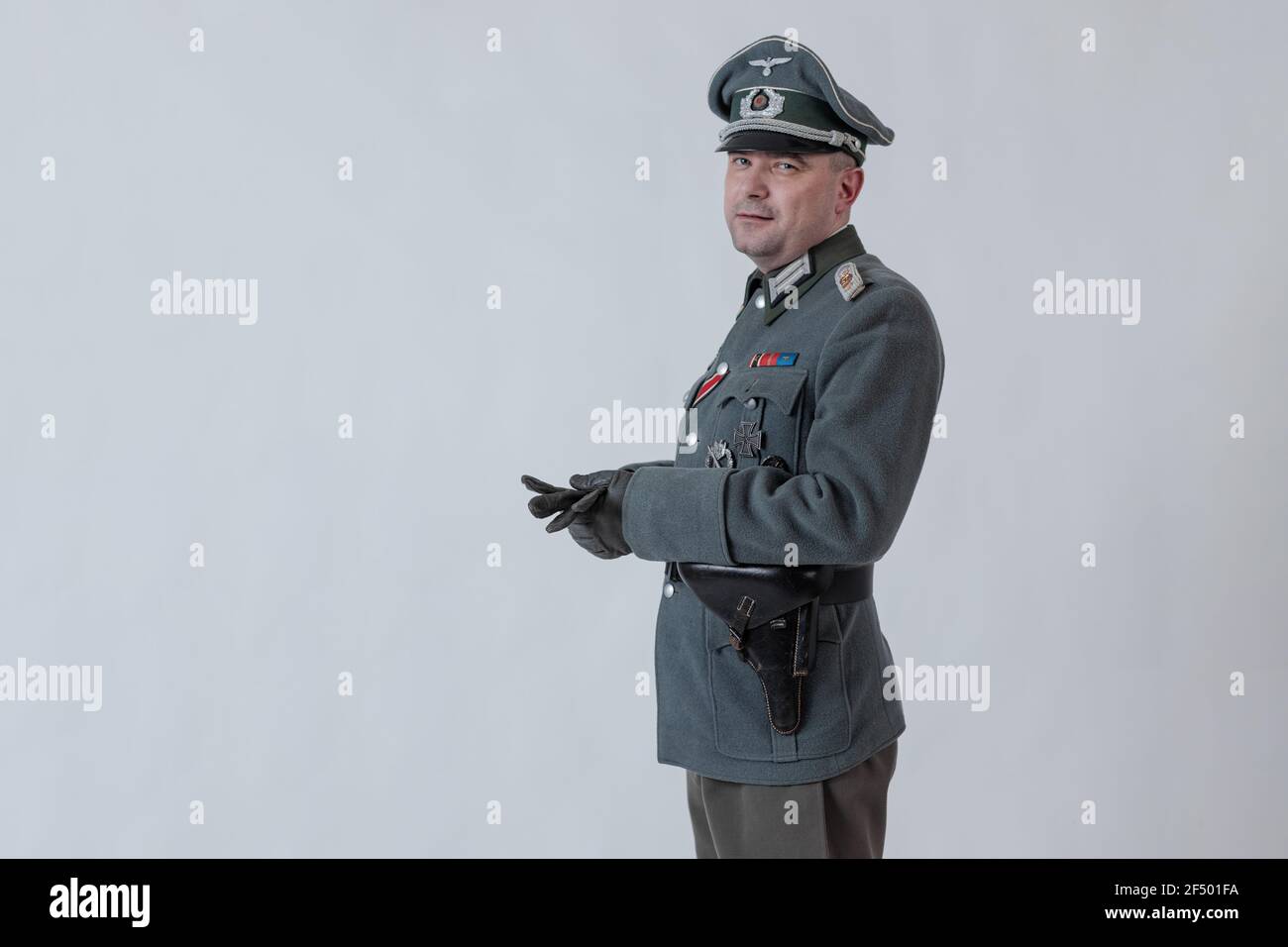Man actor in the movie role of an old military man posing against white ...