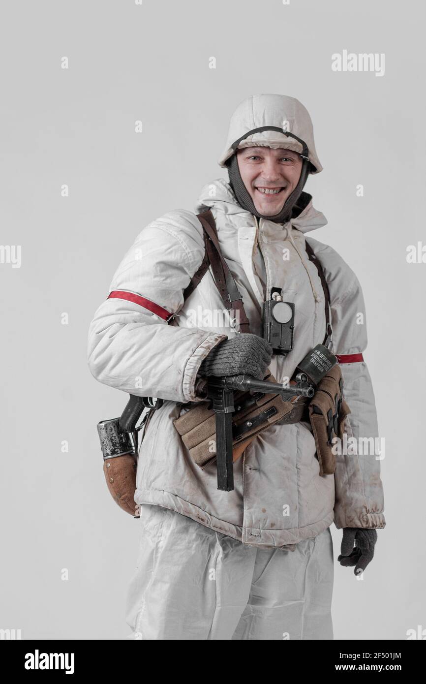 male actor in the winter military uniform of an German soldier, the ...