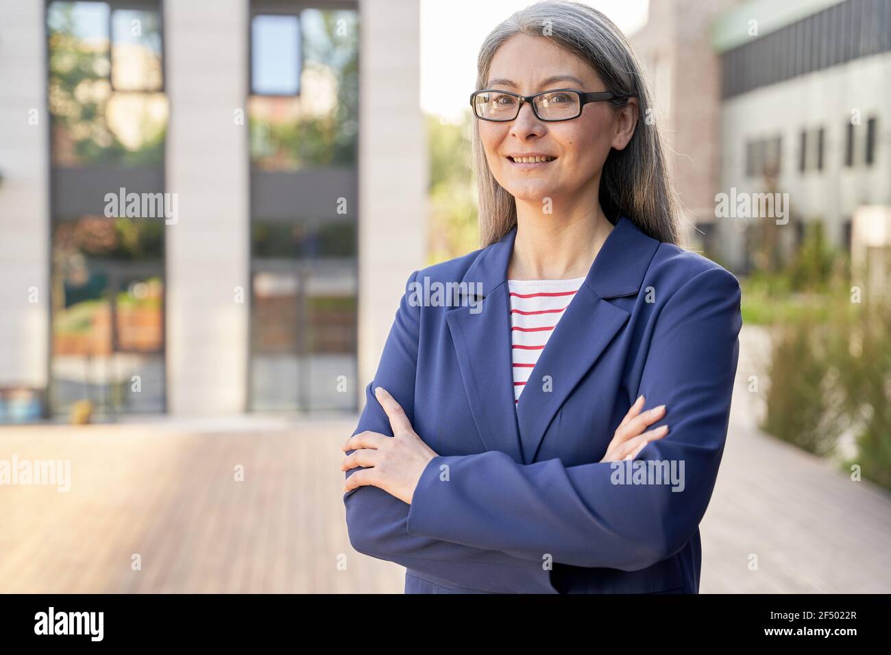 Professional lady in classy outfit posing for the camera Stock Photo ...