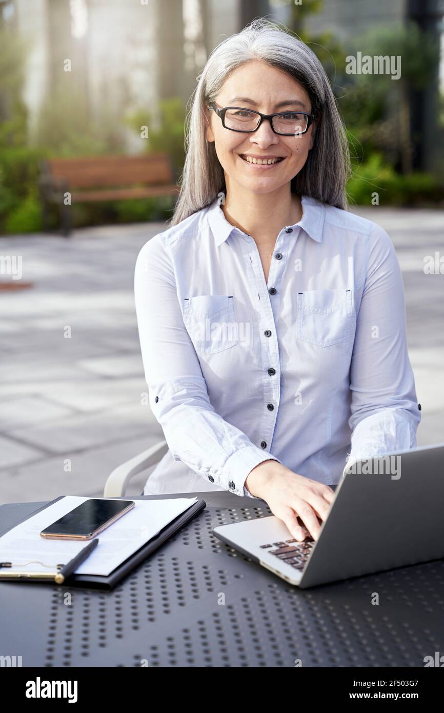 Professional lady feeling contented with her freelance job Stock Photo ...