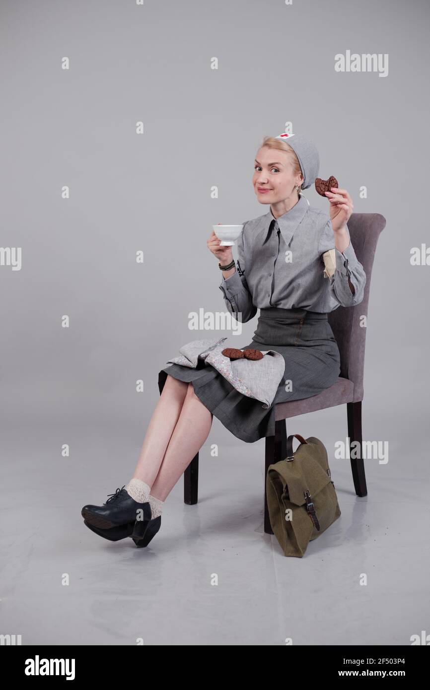 Woman actor reenactor in the historical uniform of the German army ...