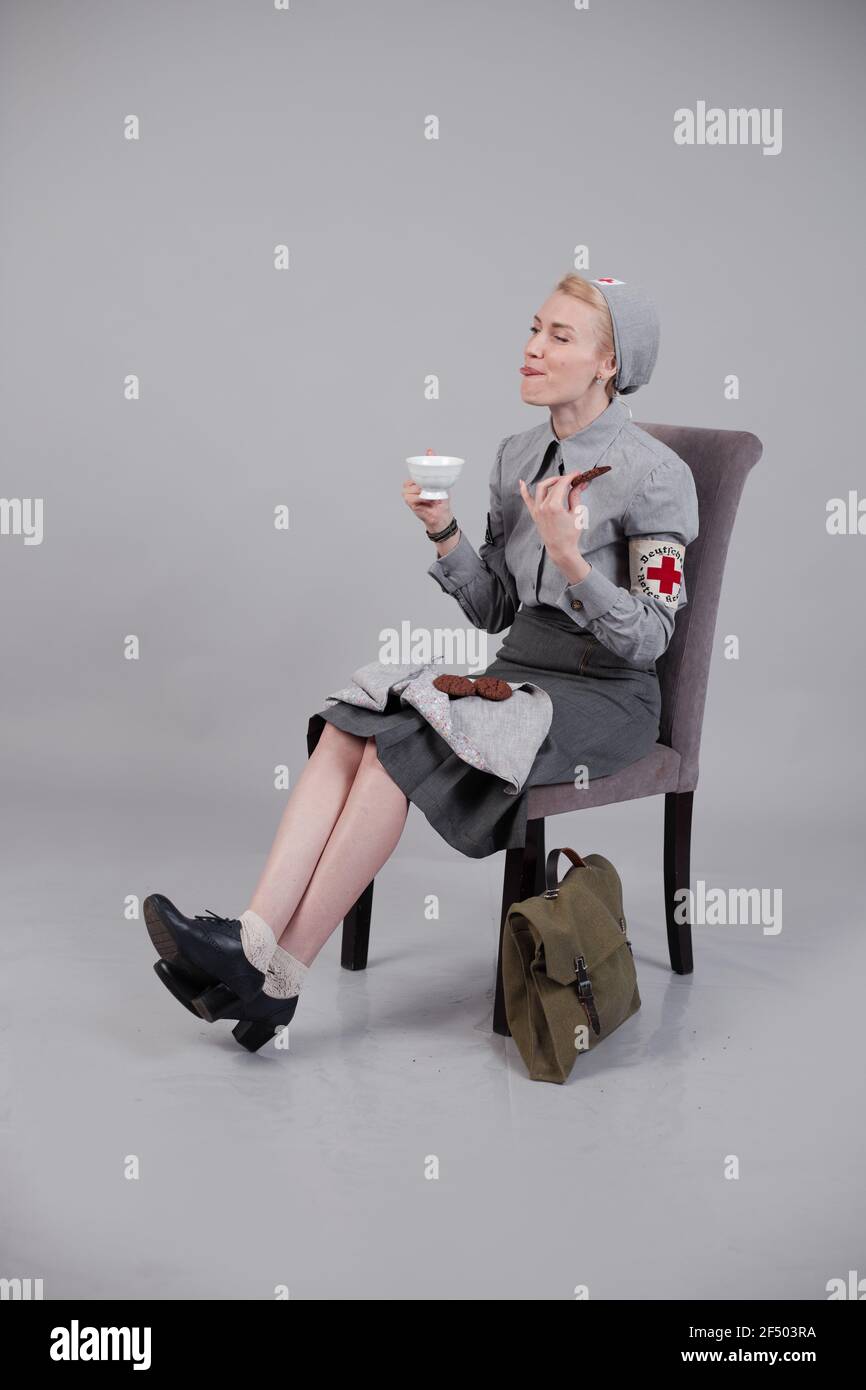 Woman actor reenactor in the historical uniform of the German army ...